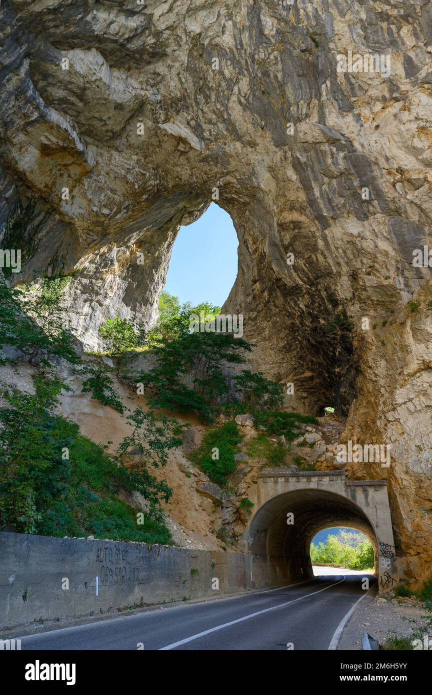 Road and tunnel at Piva Lake in national park Dormitor of Montenegro at ...