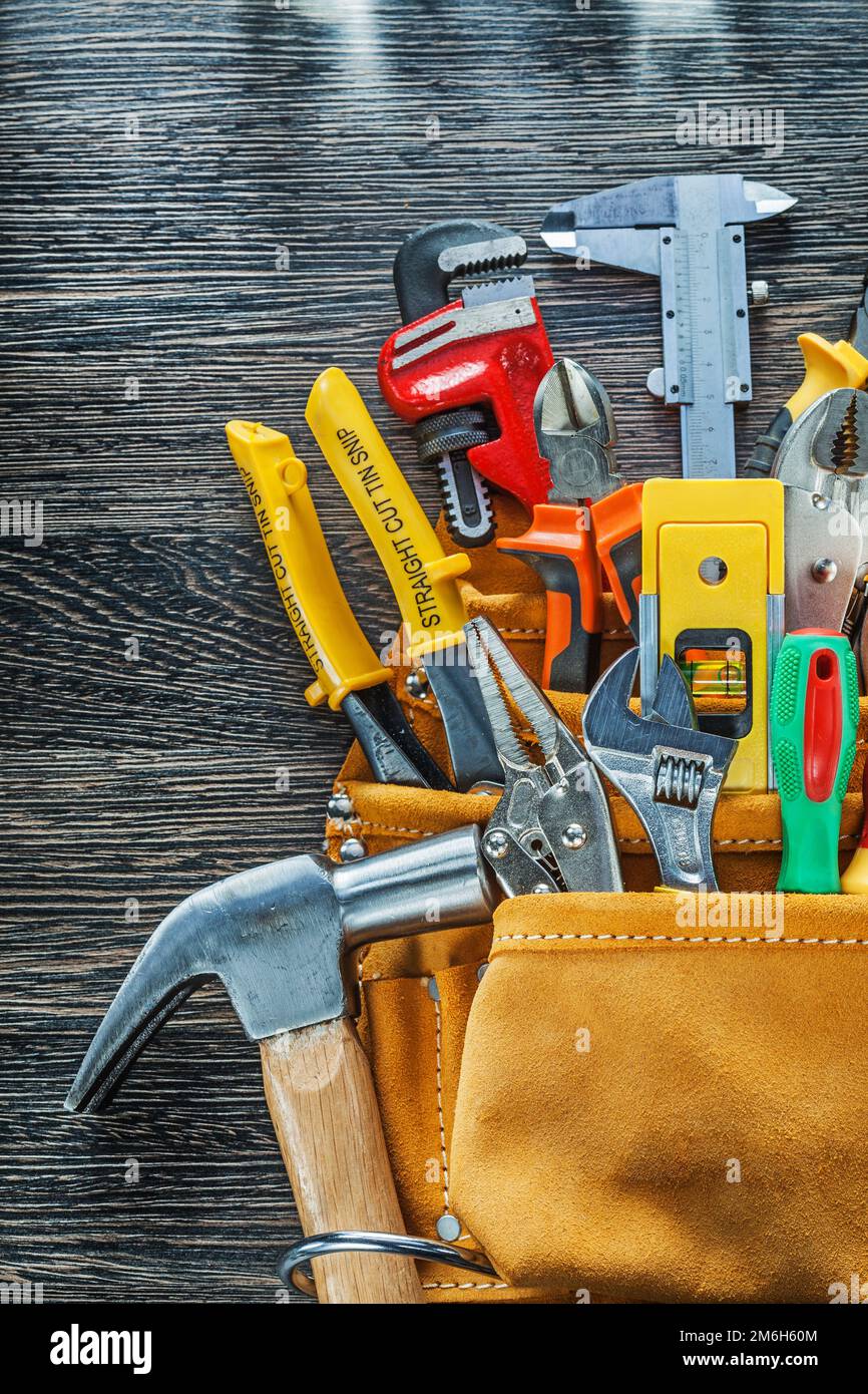 Leather tool belt construction tooling on wooden board vertical image ...