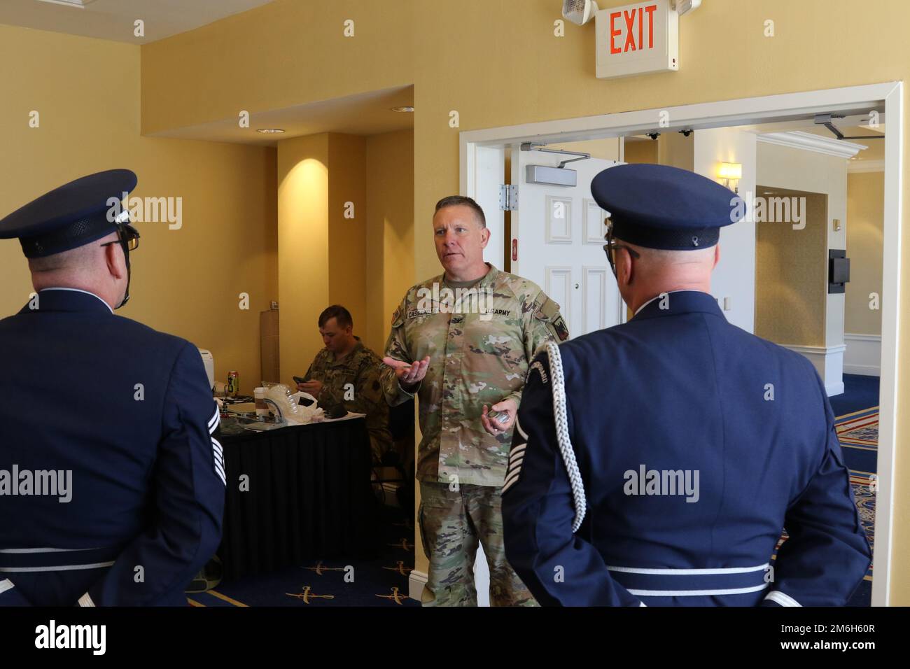 U.S. Army Col. James Cassarella presents challenge coins to members of ...