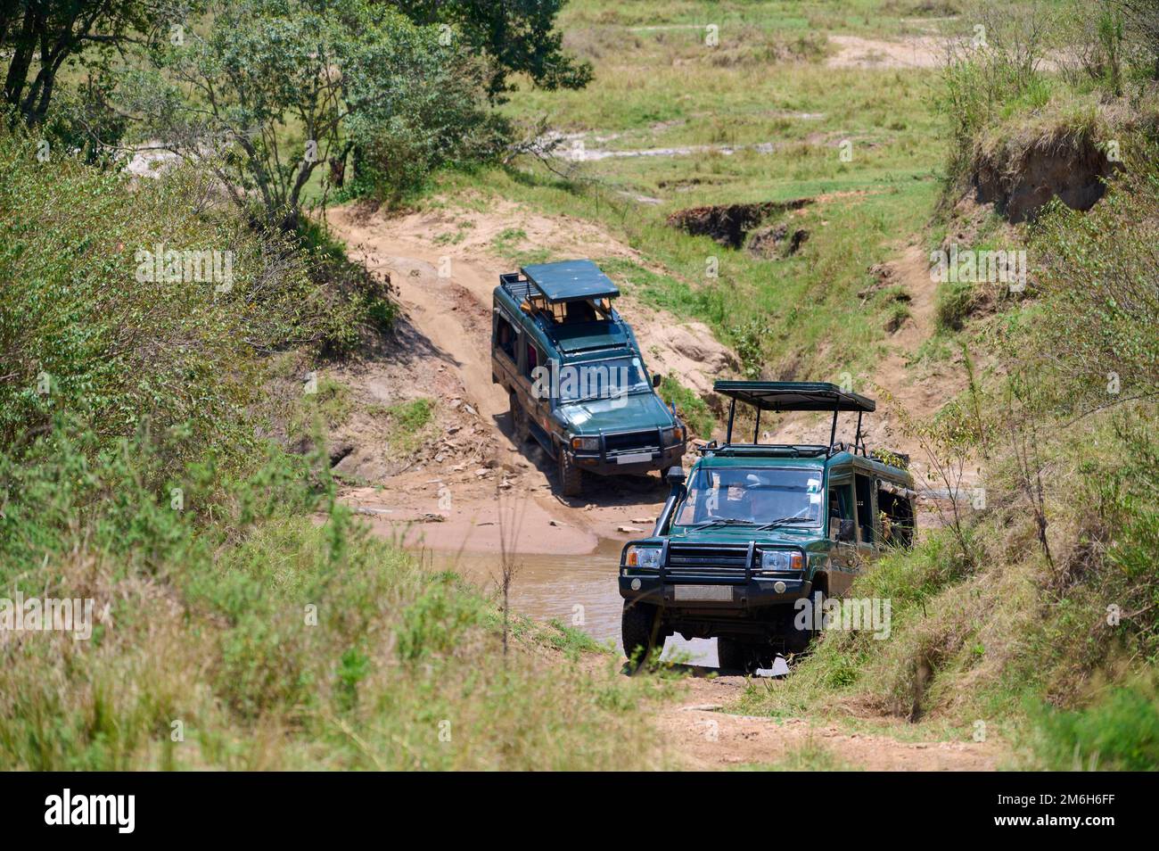 Safari car at river crossing, Masai Mara National Reserve, Kenya Stock ...