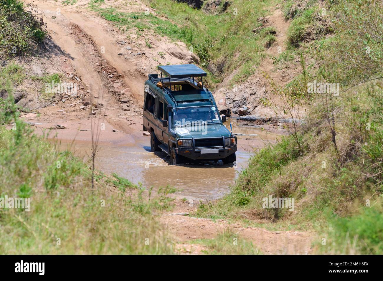 Safari car at river crossing, Masai Mara National Reserve, Kenya Stock ...