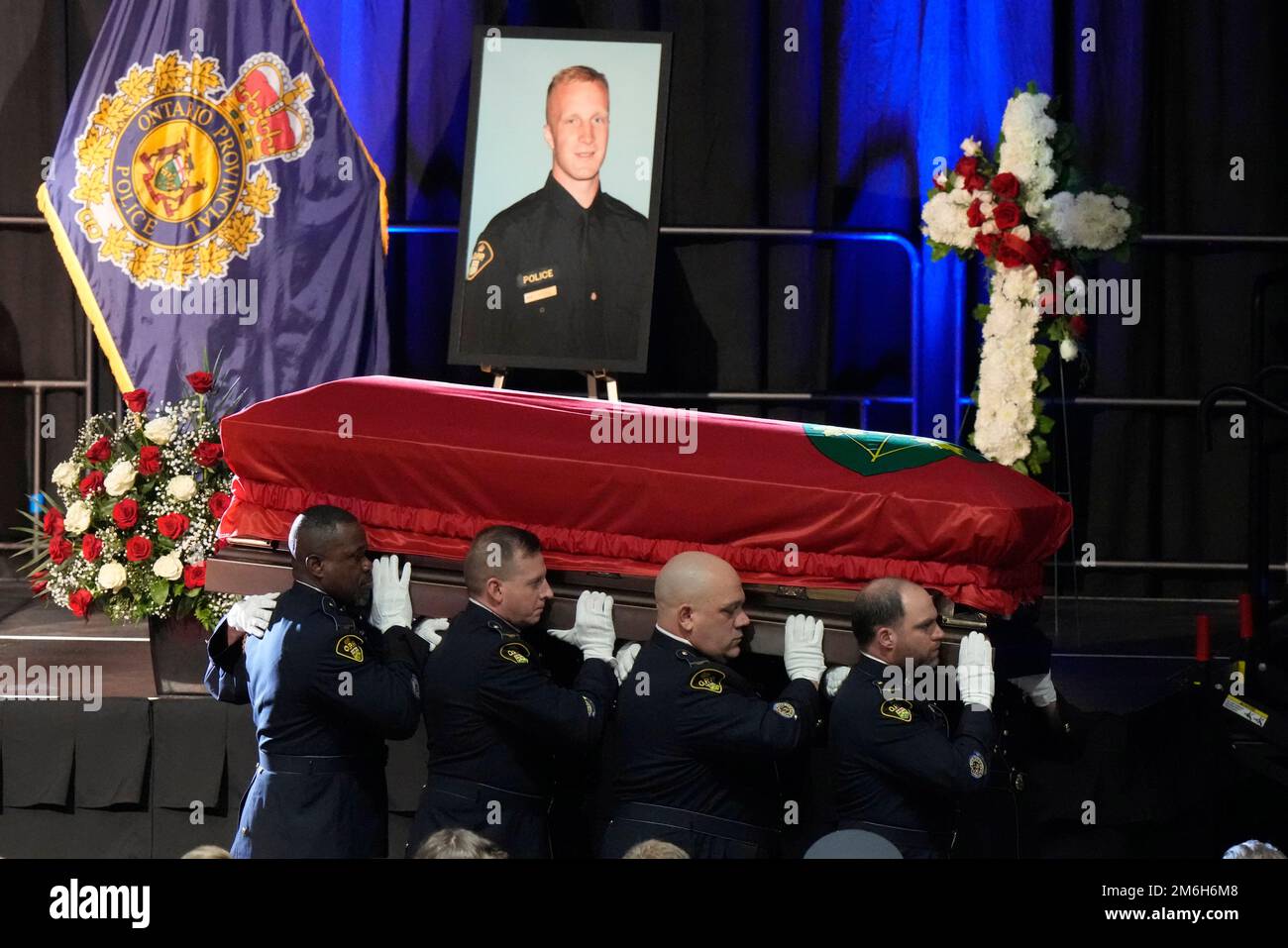 Pallbearers carry the casket of OPP Const. Grzegorz (Greg) Pierzchala ...