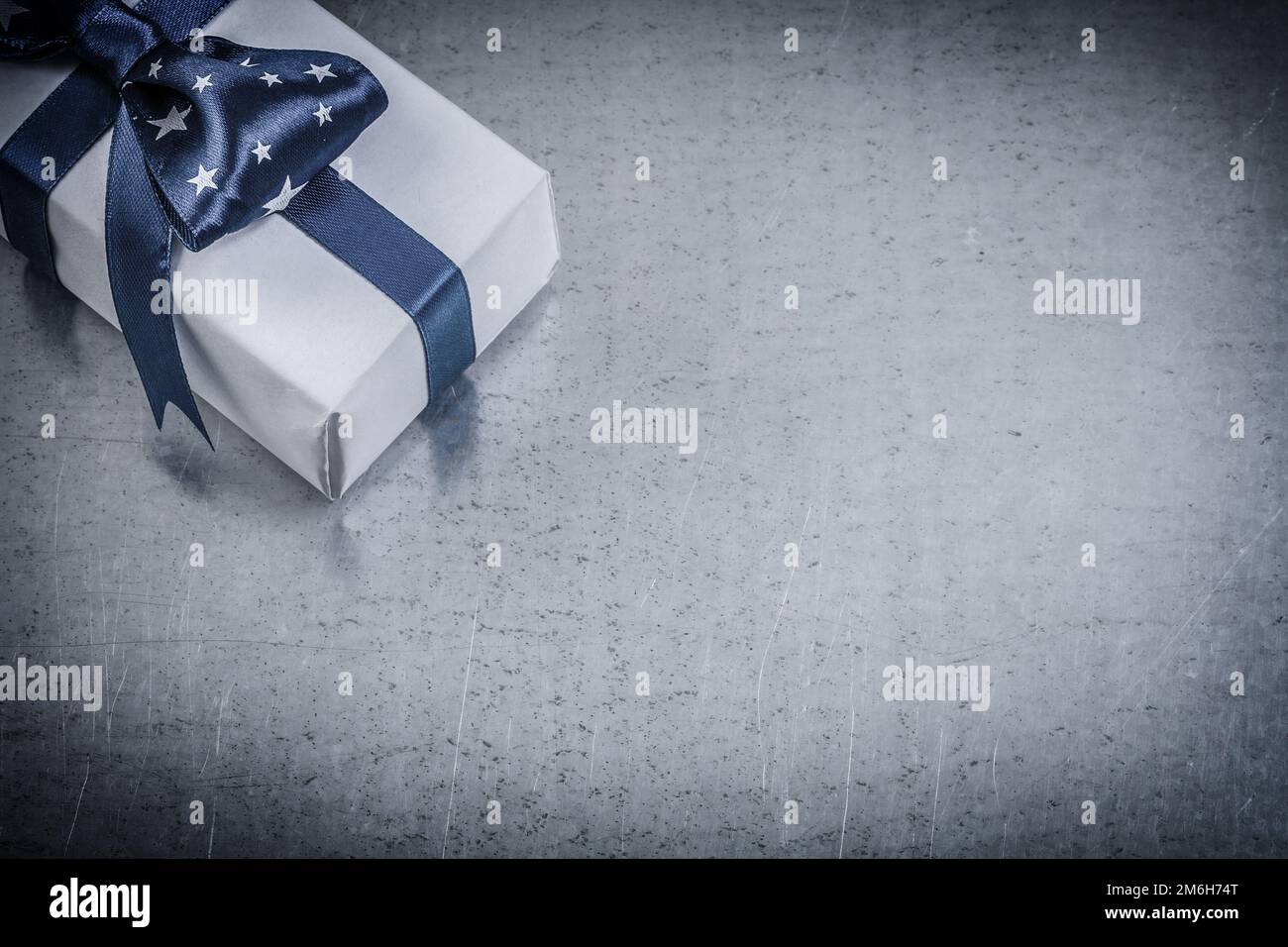 Packed box-container with tied bow on metallic background celebrations ...