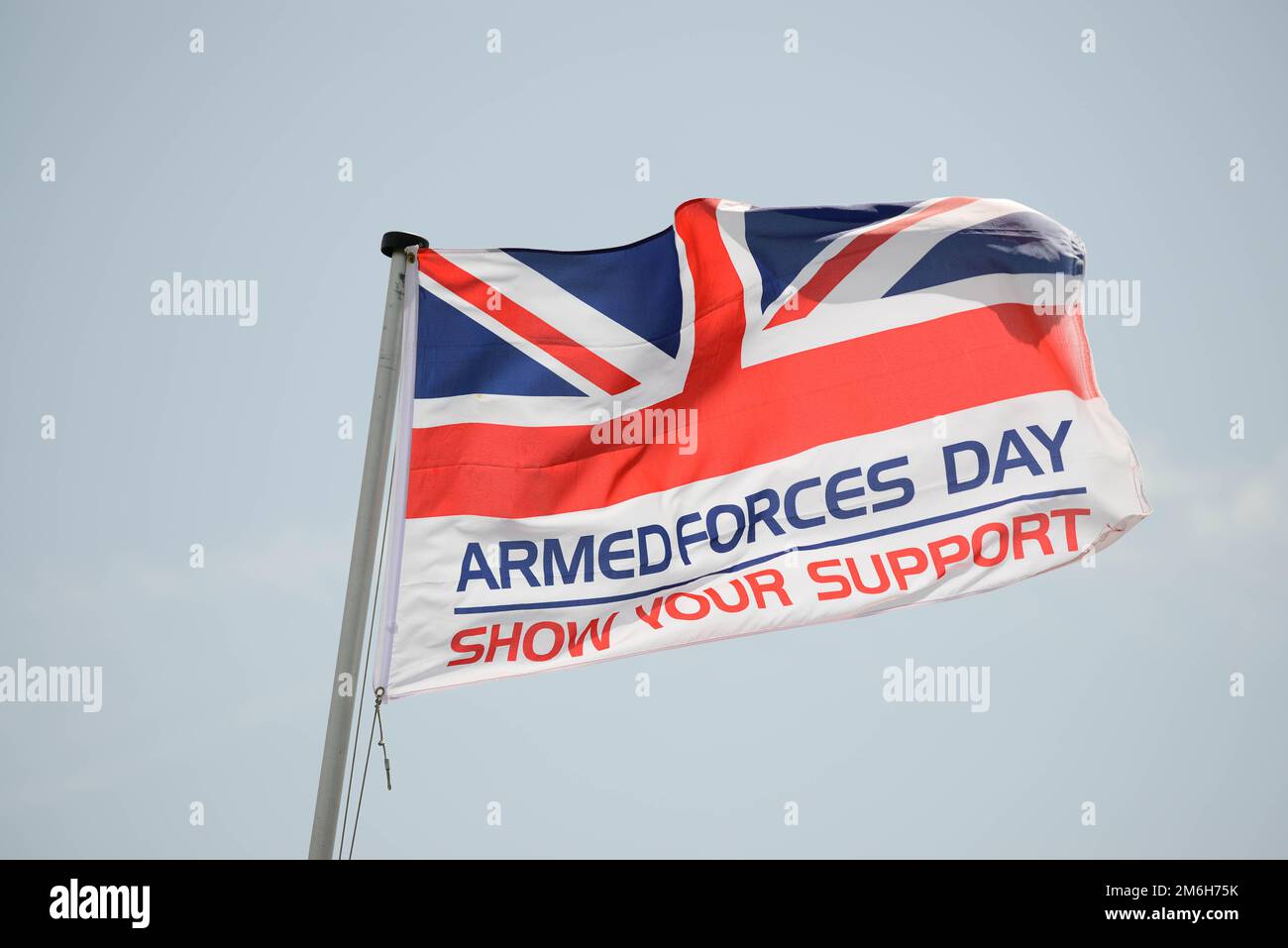 An Armed Forces Day flag flies flying on a flag pole Stock Photo - Alamy