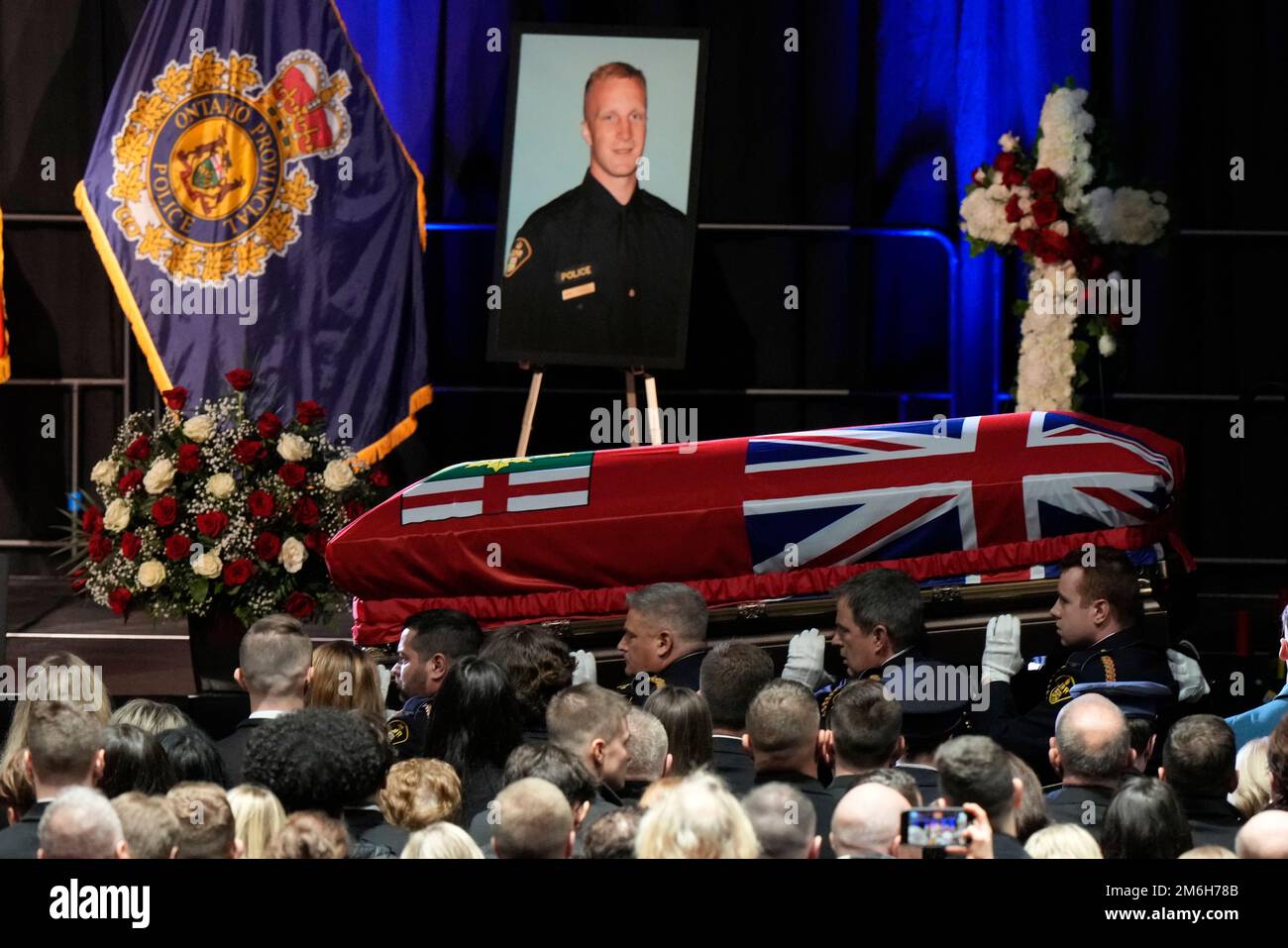 Pallbearers carry the casket of OPP Const. Grzegorz (Greg) Pierzchala ...