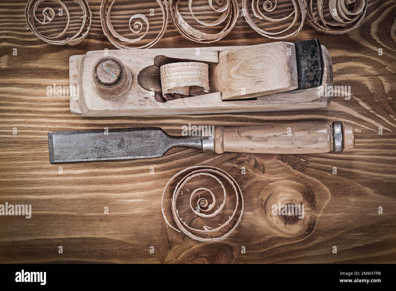 Planer chisels curled shavings on vintage wooden board construction ...