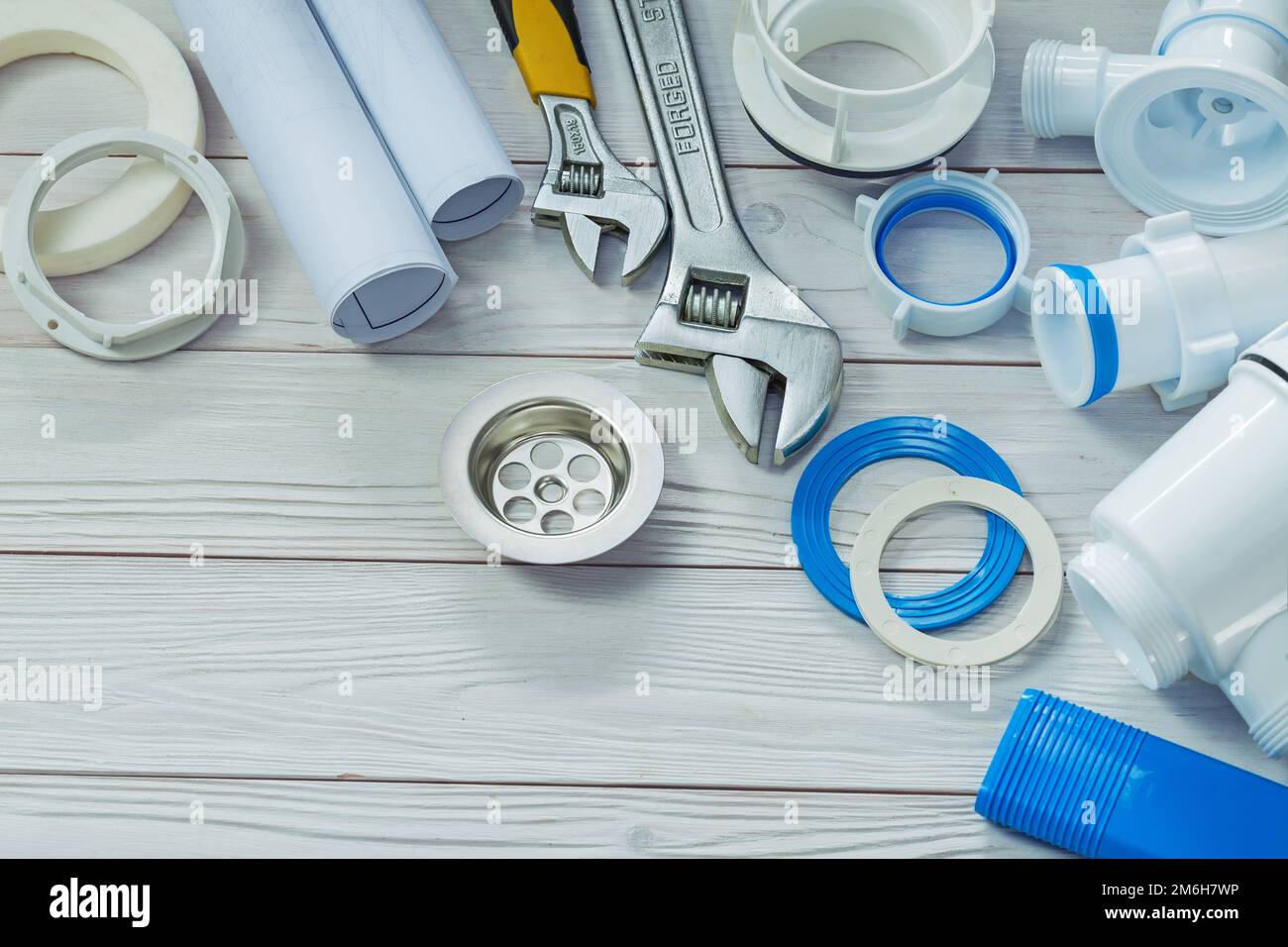 piping accessories white sanitary plastic pipes on painted wood Stock ...