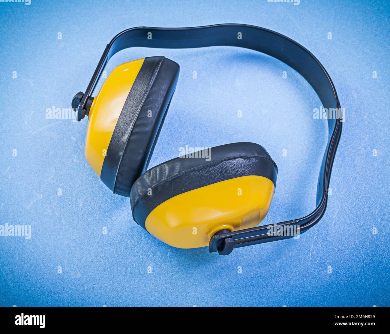 Blue and yellow ear muffs hi-res stock photography and images - Alamy
