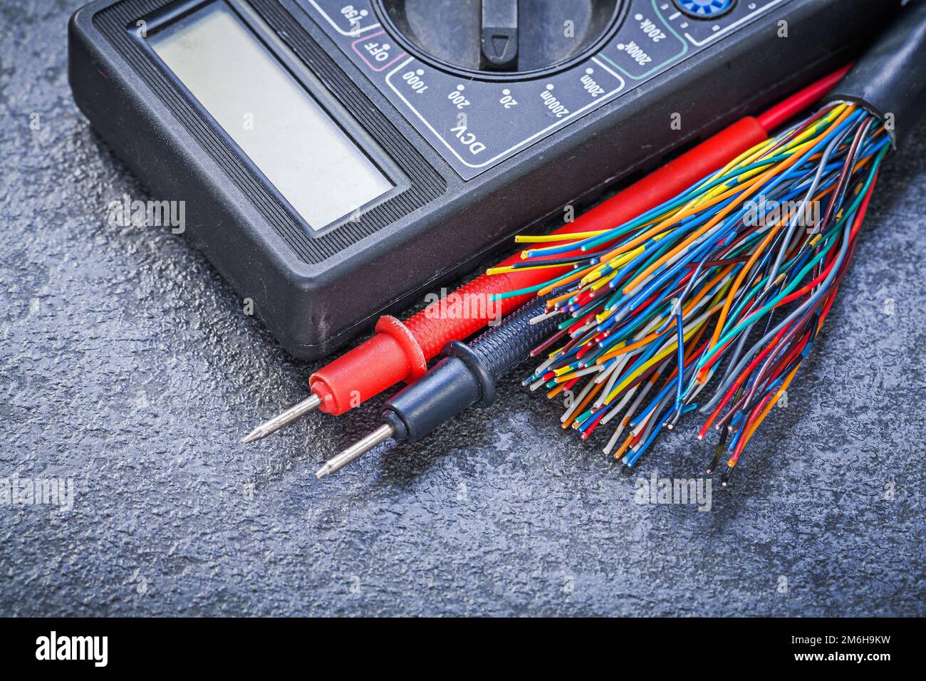 Set of digital multimeter electric tester wires on black background ...