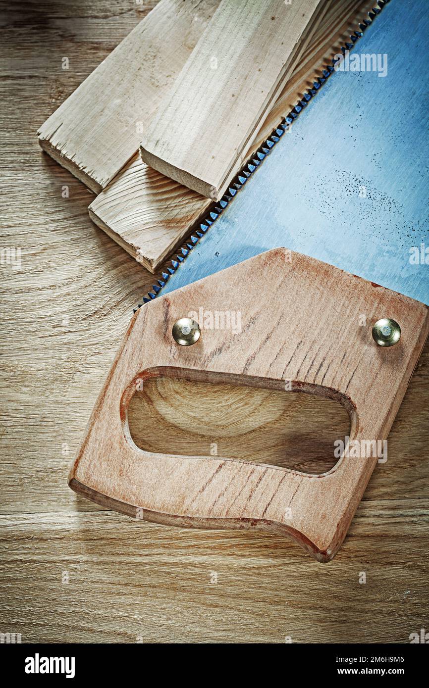 Set of hacksaw timber on wood board construction concept Stock Photo ...
