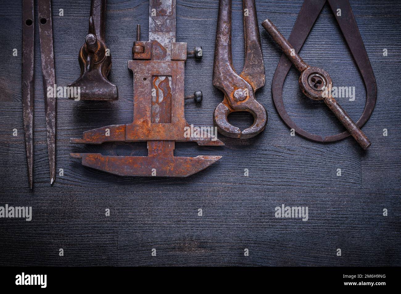set of old tools on vintage board Stock Photo - Alamy