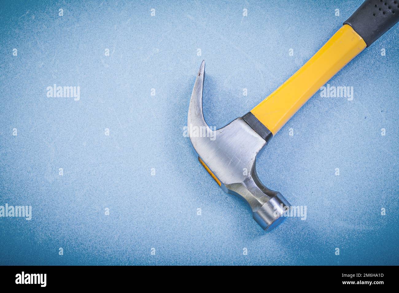 Stainless claw hammer on blue background construction concept Stock ...