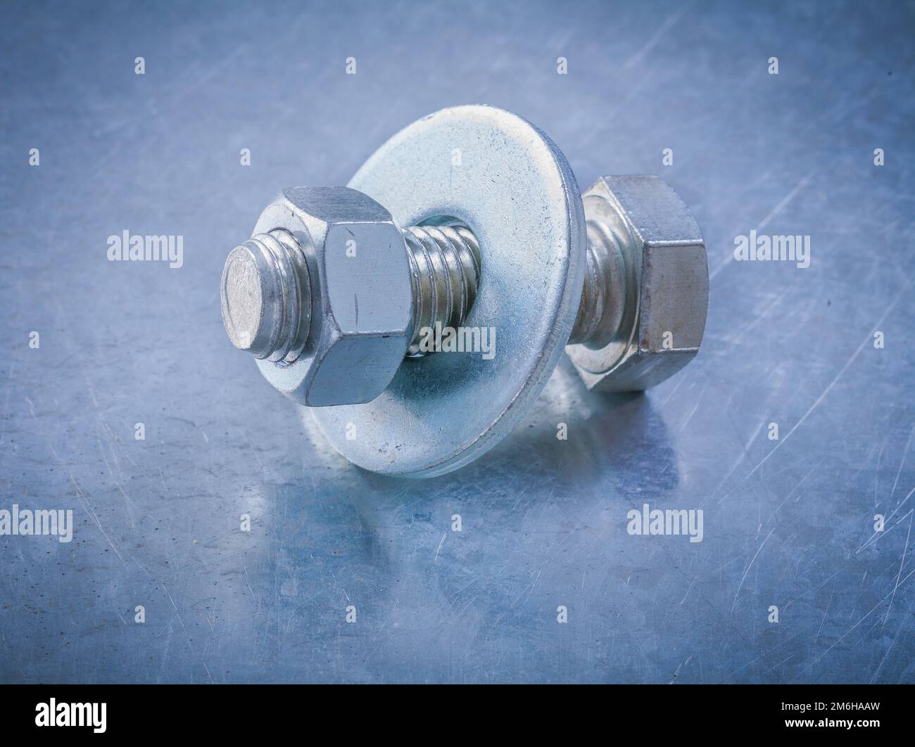 Threaded bolt washer screwbolt construction nuts on scratched metallic ...