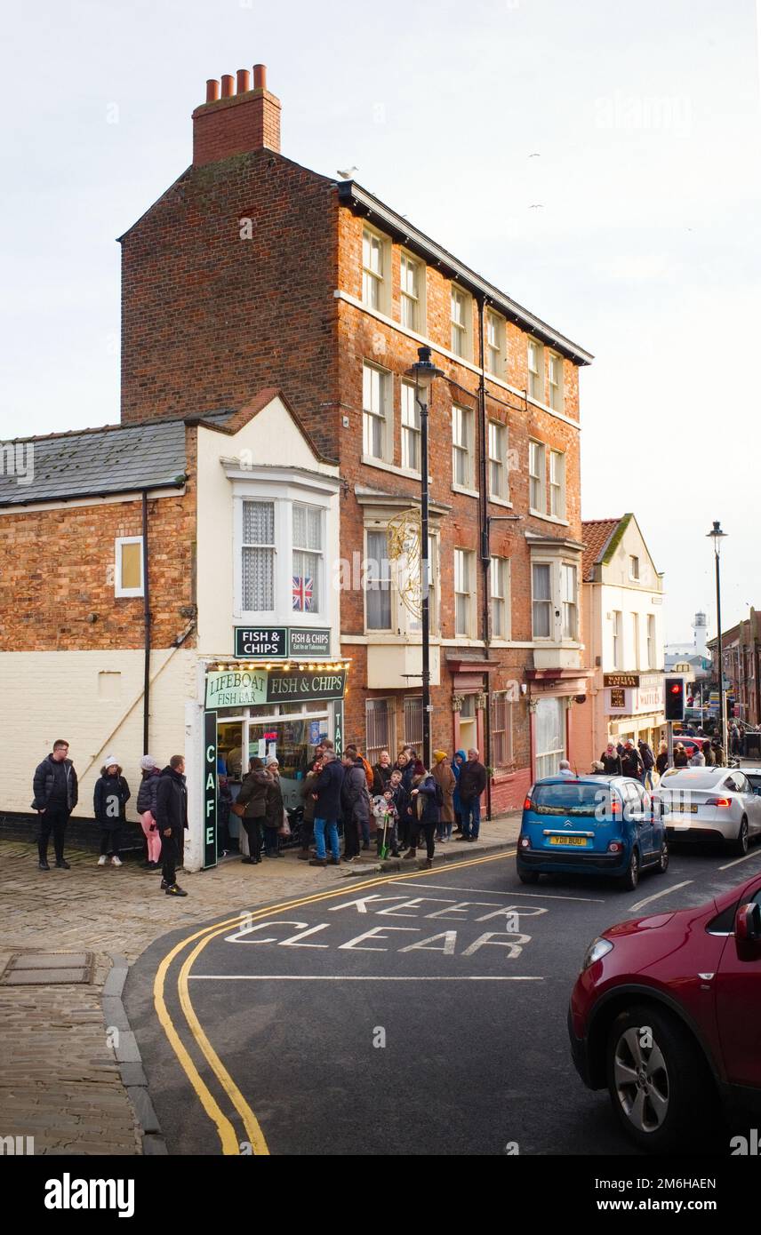 Queue outside the famous Lifeboat fish and chip shop in Eastborough ...