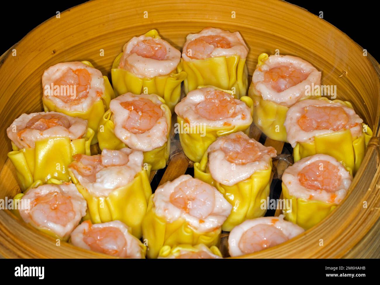 Dim Sum with fish farce and prawns, food photography with black ...