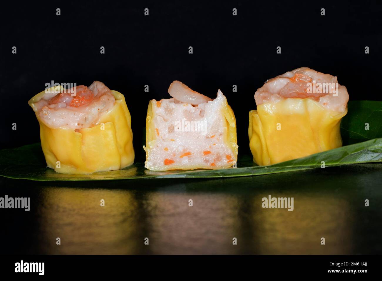 Dim Sum with fish farce and prawns, food photography with black ...