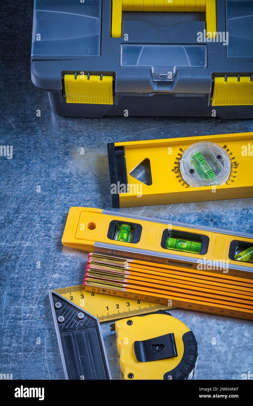 Toolbox construction levels and instruments of measurement on scratched ...