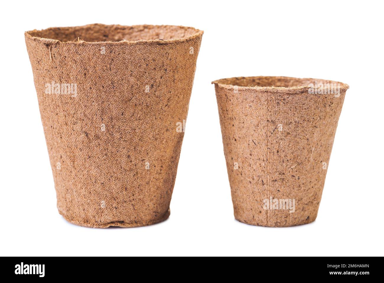 Two peat pots isolated on white background Stock Photo - Alamy