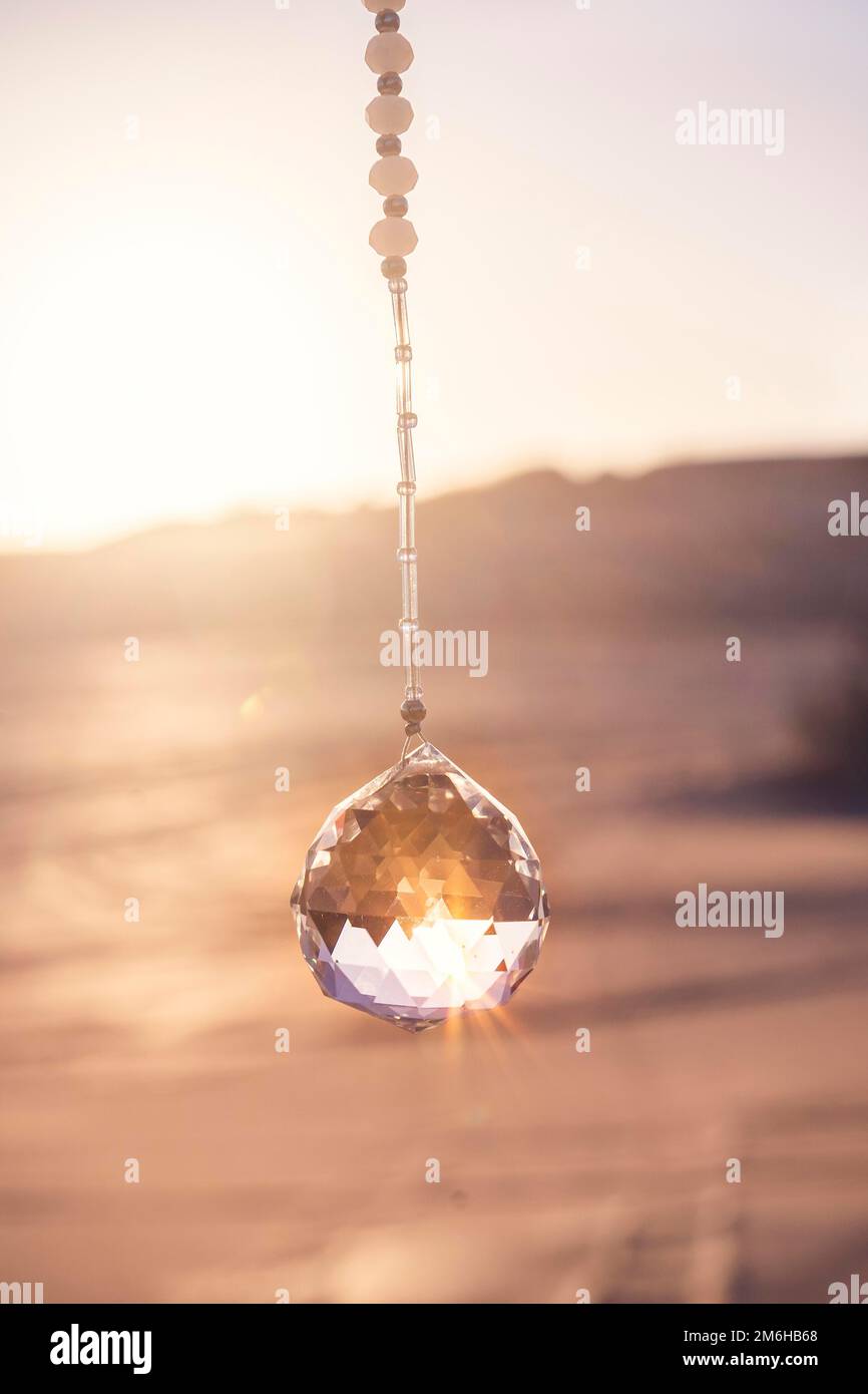 A suncatcher reflecting the sunshine at the beach Stock Photo - Alamy