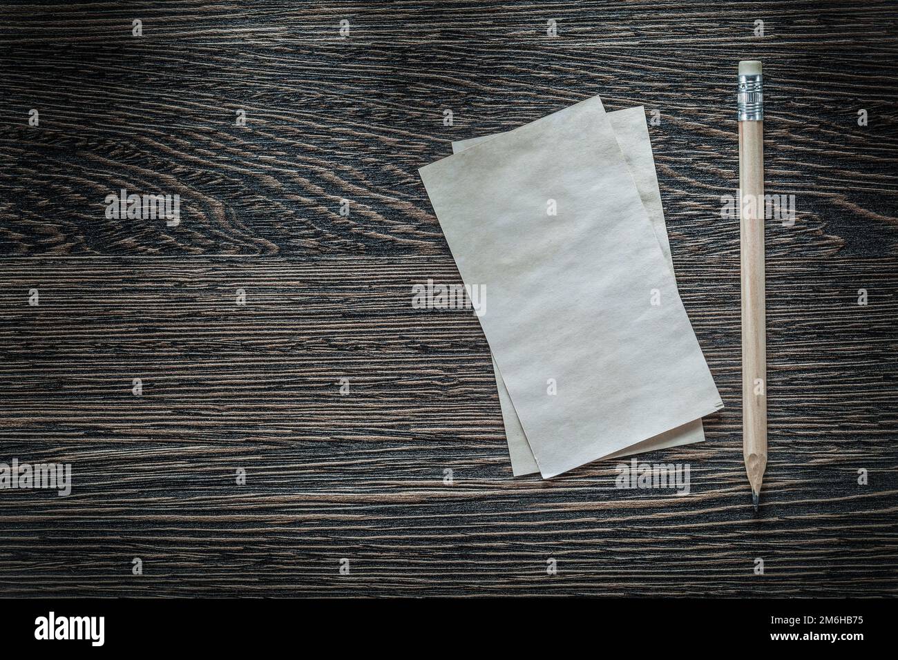 Vintage blank paper sheet pencil on black board Stock Photo - Alamy