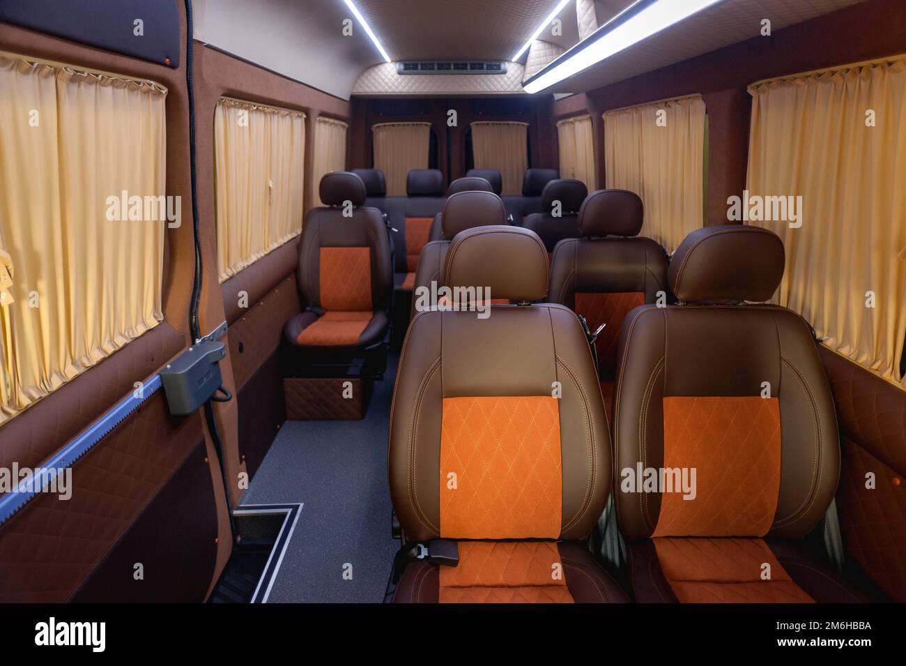 comfortable passenger bus interior with upholstered seats; individual ...