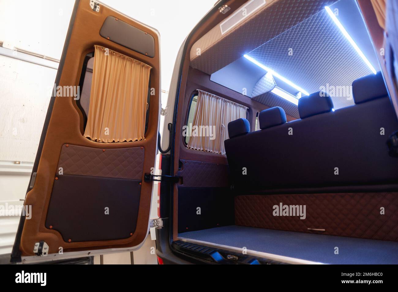 comfortable passenger bus interior with upholstered seats; individual ...