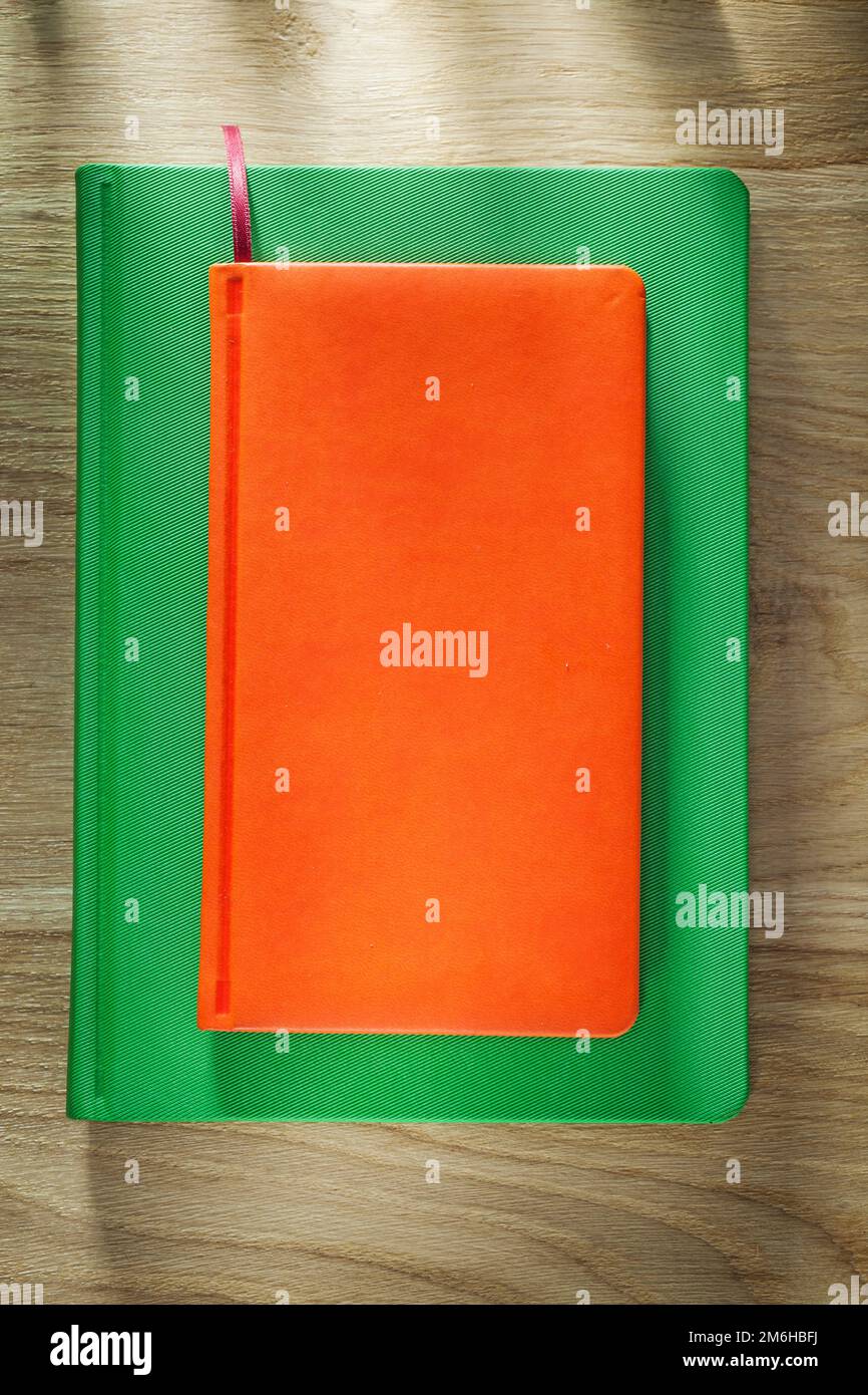 Vintage notebooks on wooden board education concept Stock Photo - Alamy