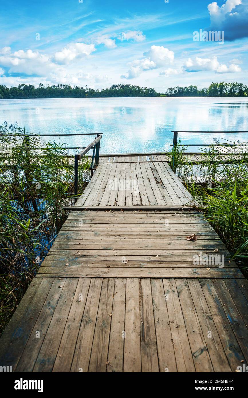 vintage wooden pier on beautiful blue lake Stock Photo - Alamy