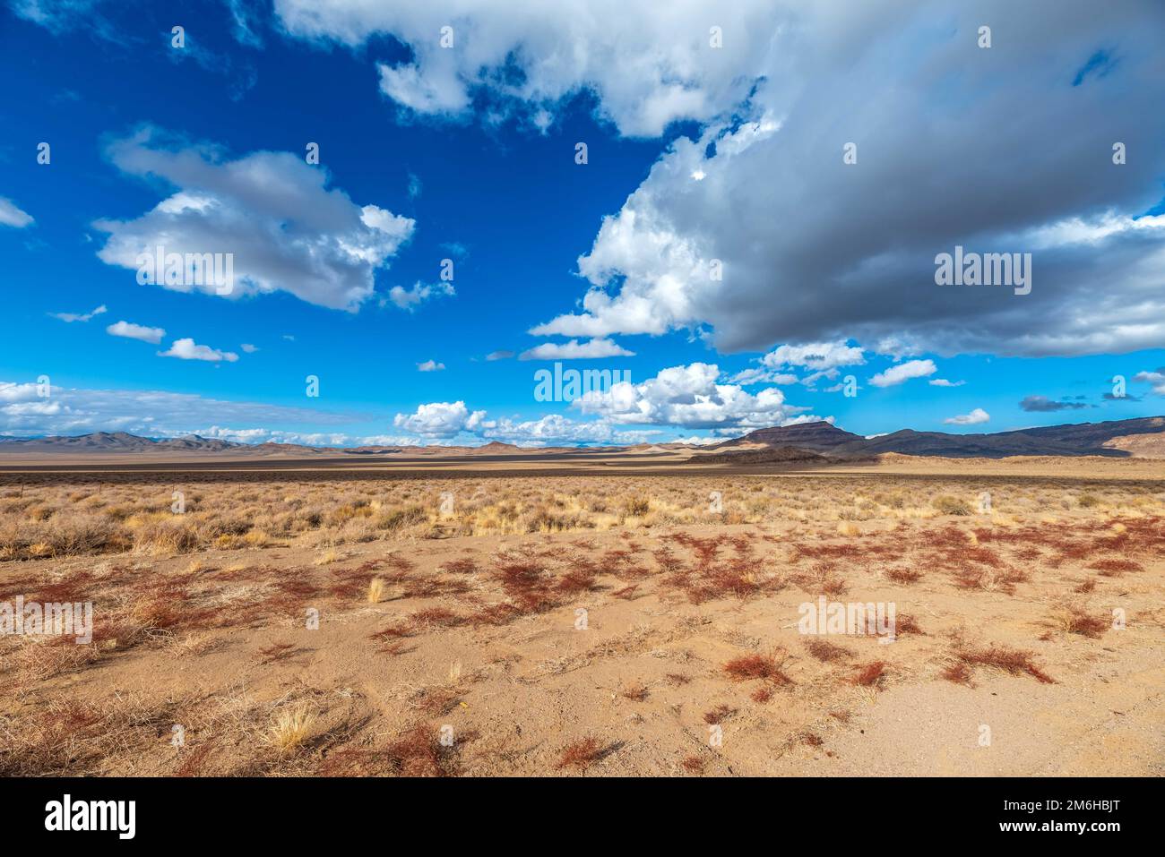 A landscape of Dramatic Clouds Desert Mountains in Nevada with blue sky ...