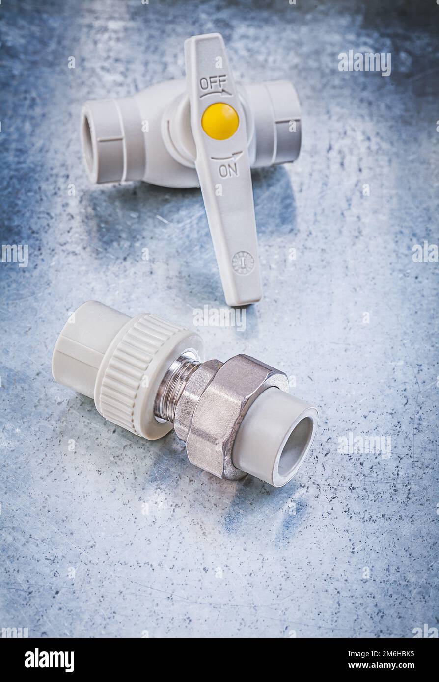 Water valve threaded pipe connectors on metallic background vertical ...