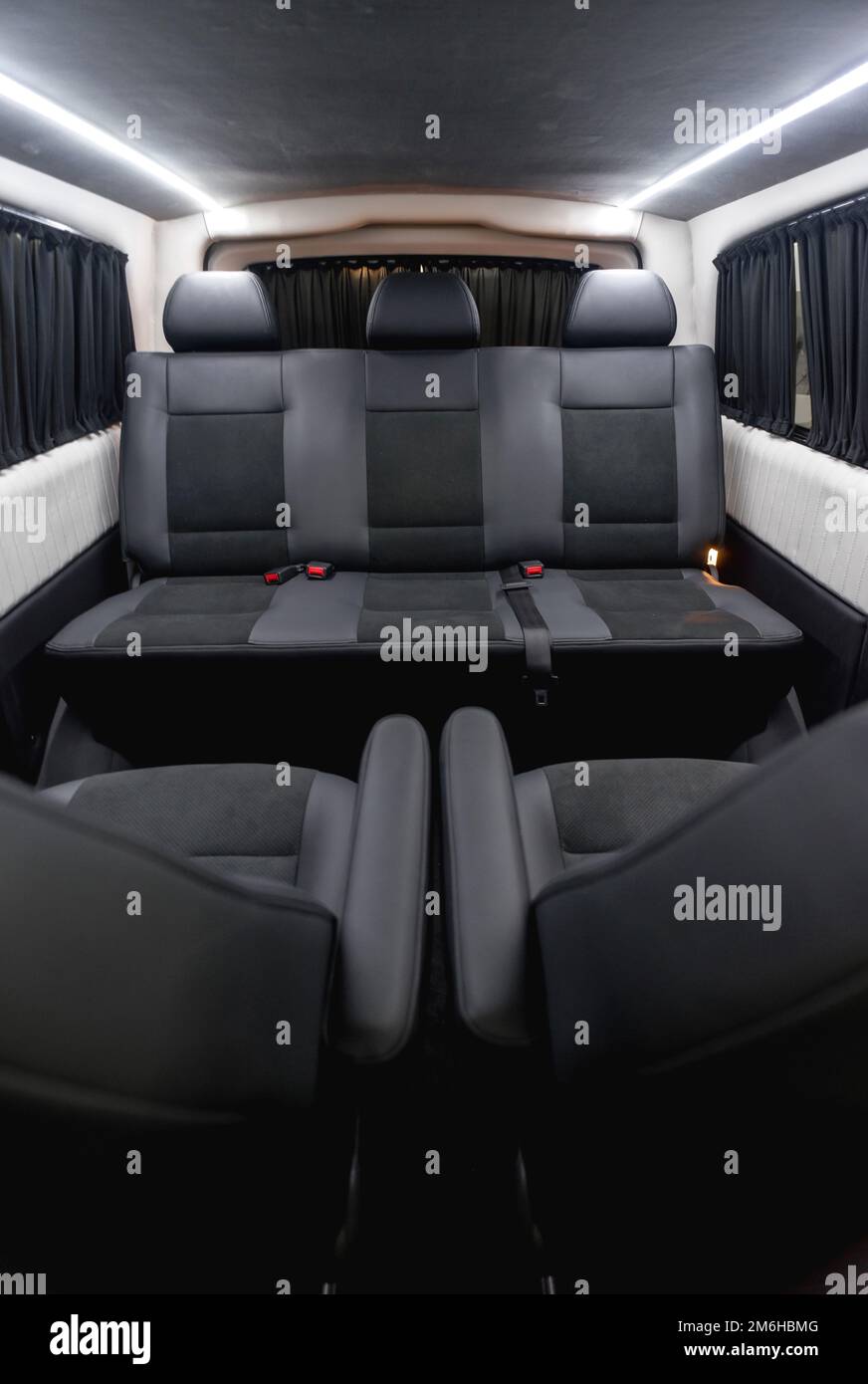 comfortable passenger bus interior with upholstered seats; individual ...