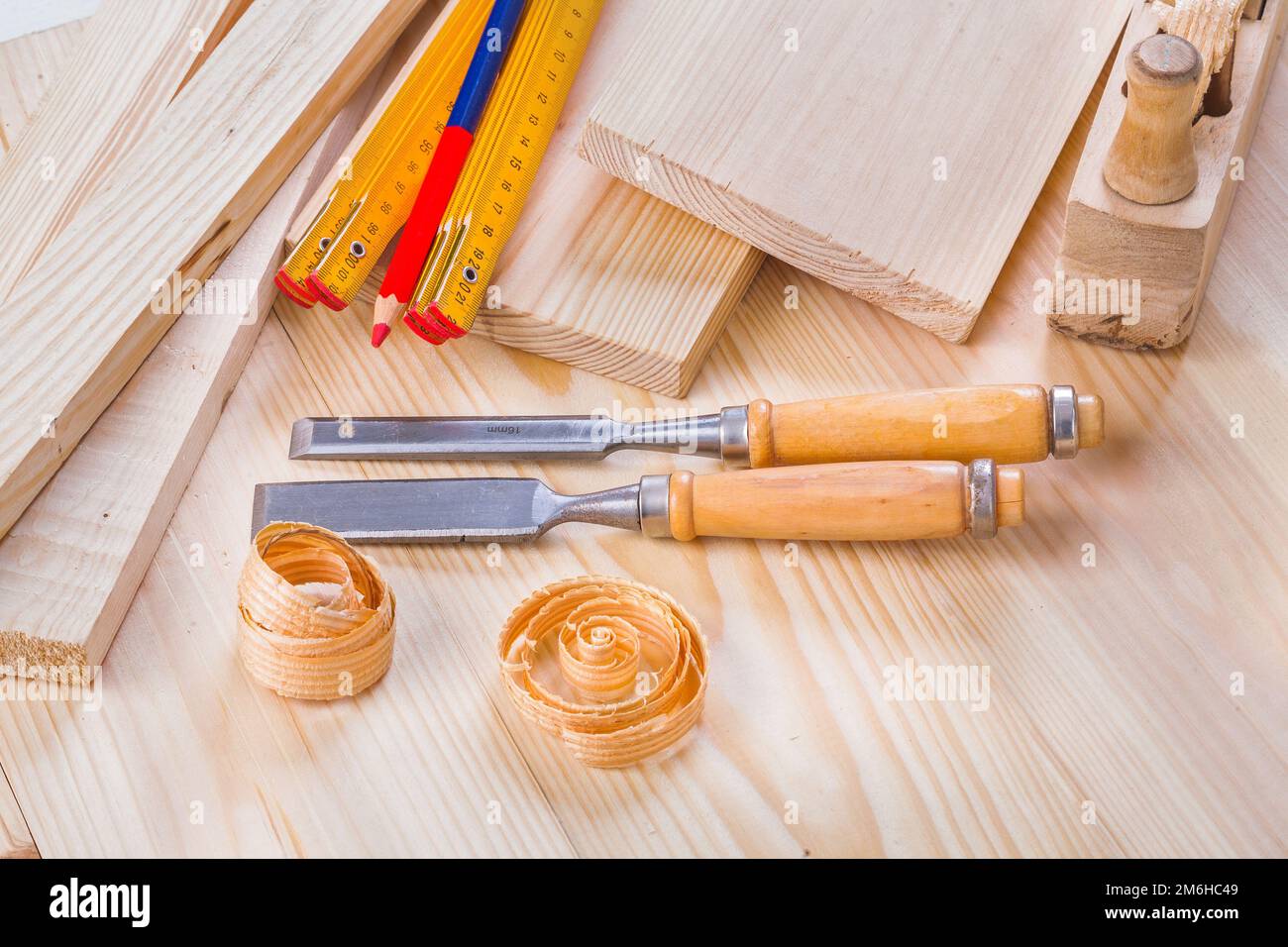 wooden meter pencil plane chisels of joiner Stock Photo - Alamy