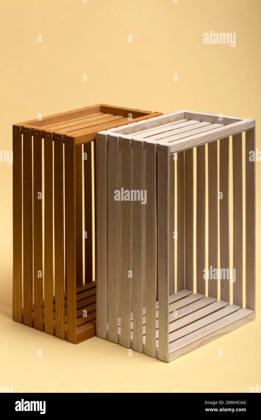 Multicolored boxes of wooden slats on a beige background Stock Photo ...