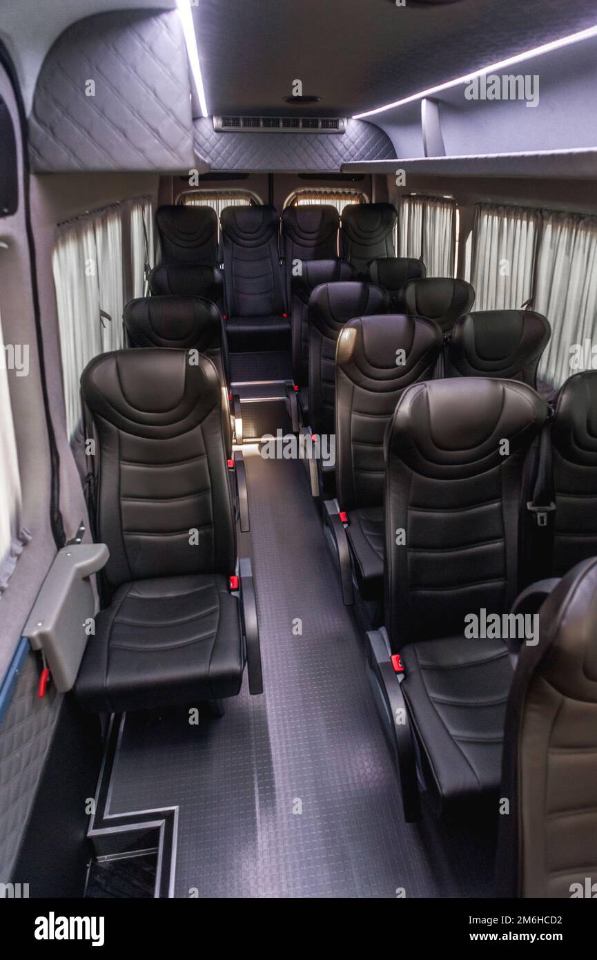 comfortable passenger bus interior with upholstered seats; individual ...