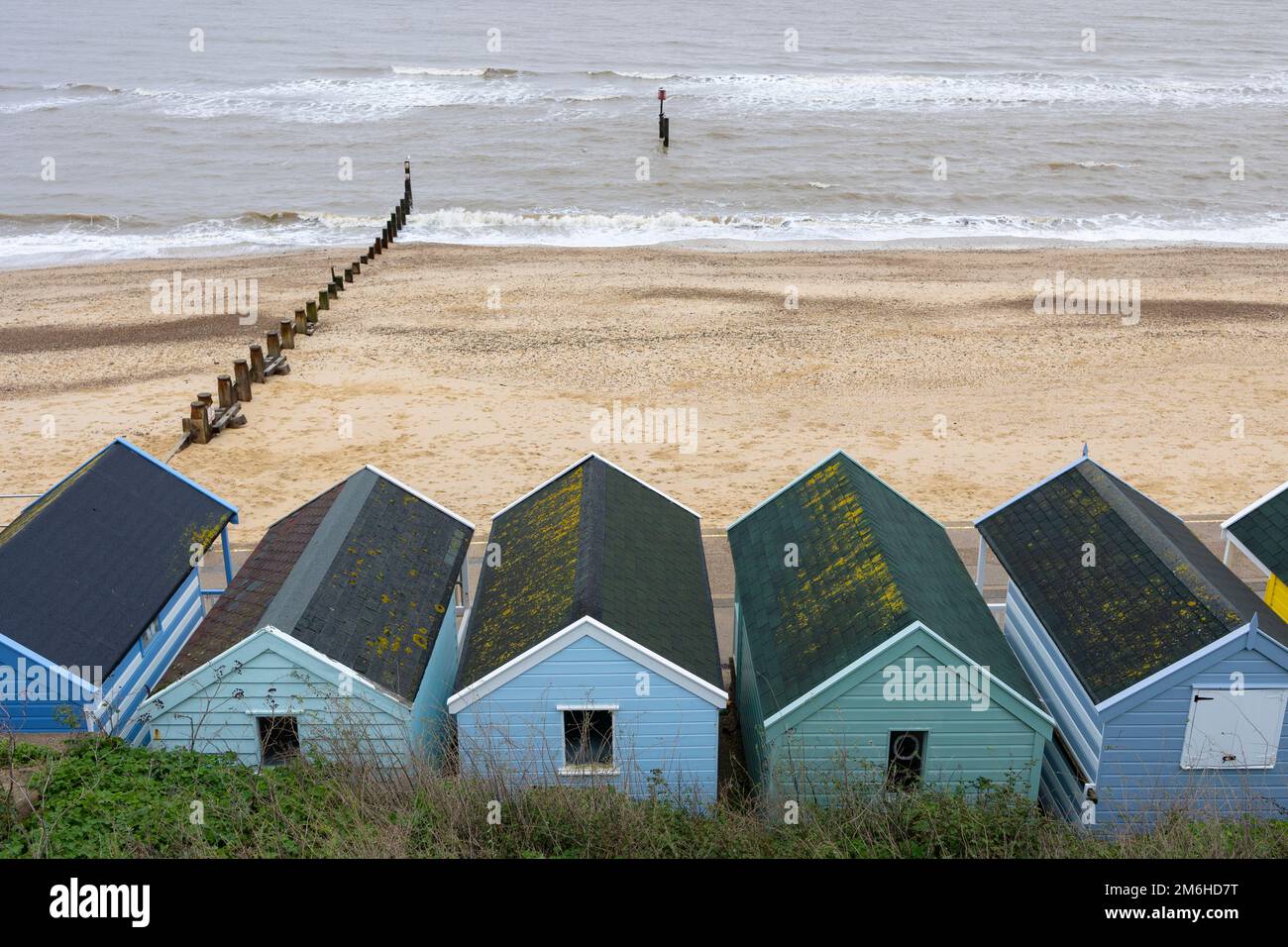 Vibrant beach huts line sandy hi-res stock photography and images - Alamy