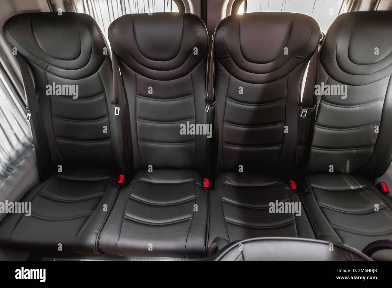 comfortable passenger bus interior with upholstered seats; individual ...