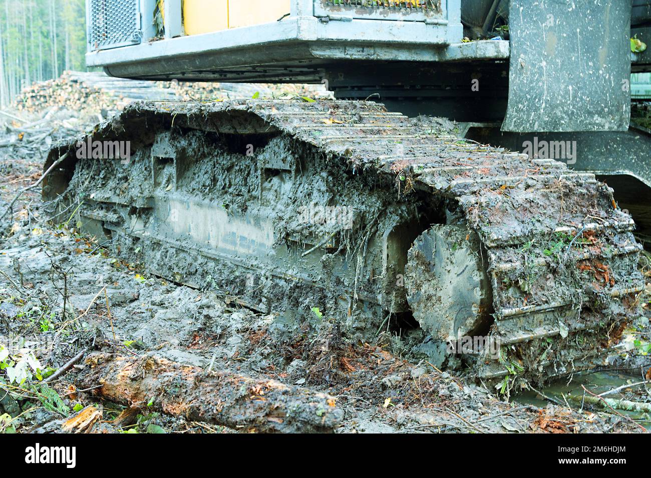 Dirty excavator tracks Stock Photo - Alamy