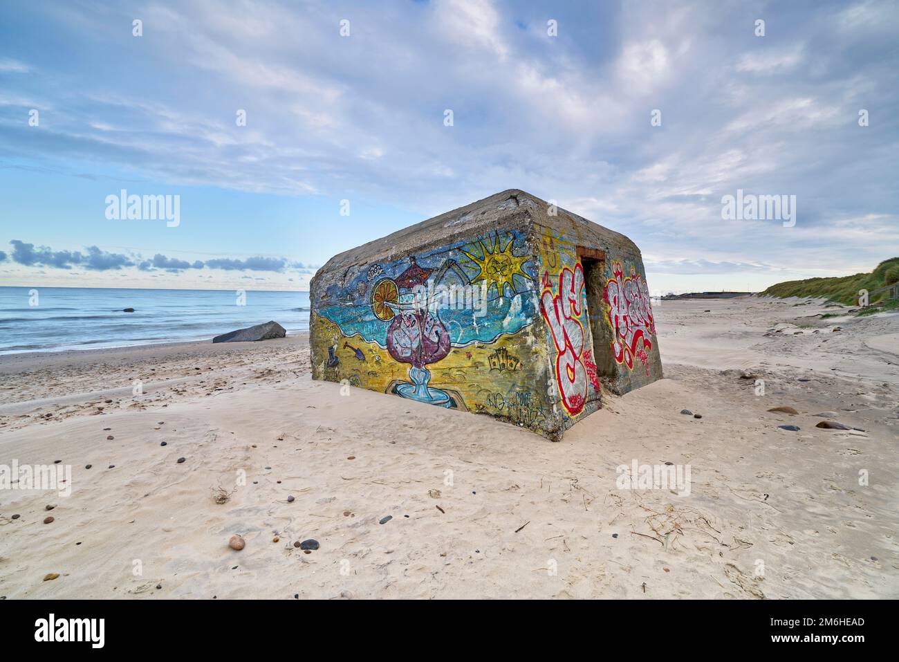 Beautiful white sandy beach with a bunker, graffiti, Hirtshals, Denmark ...