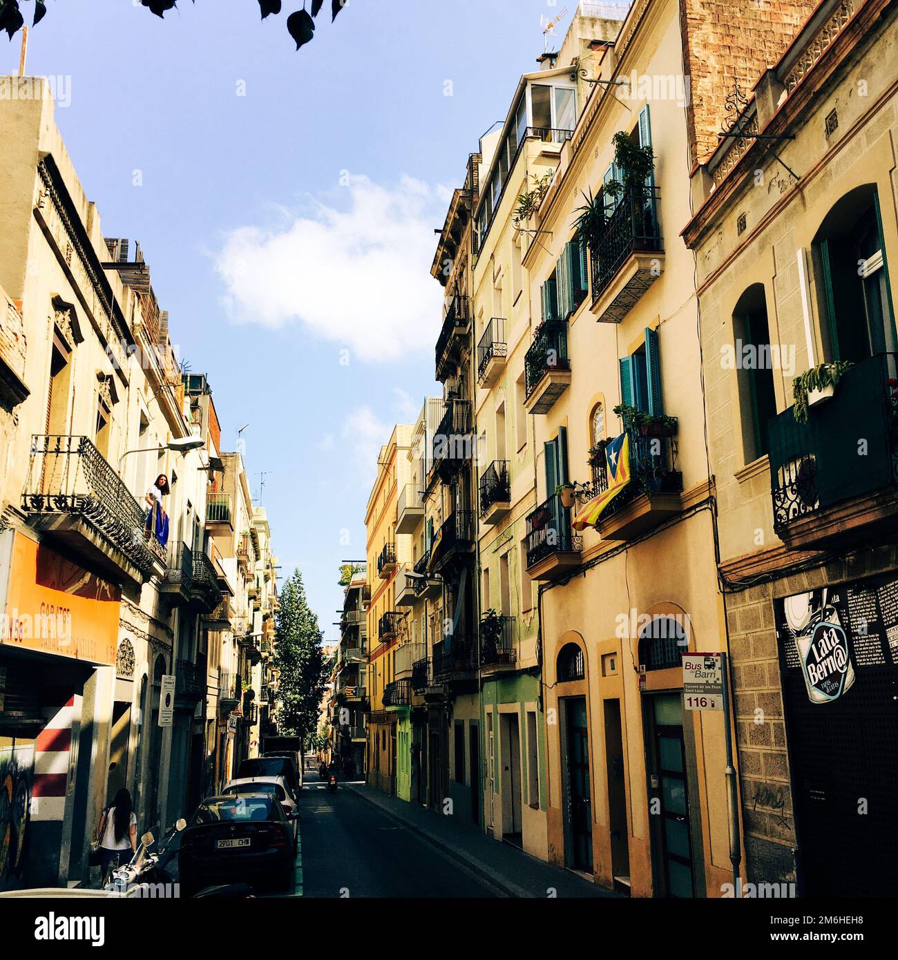 An amazing view of a street with colorful buildings in Barcelona city ...