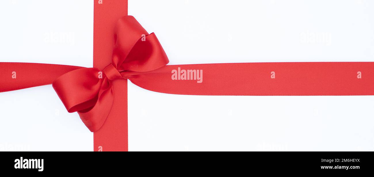 Satin ribbon bow for gift box in red color, isolated on white ...