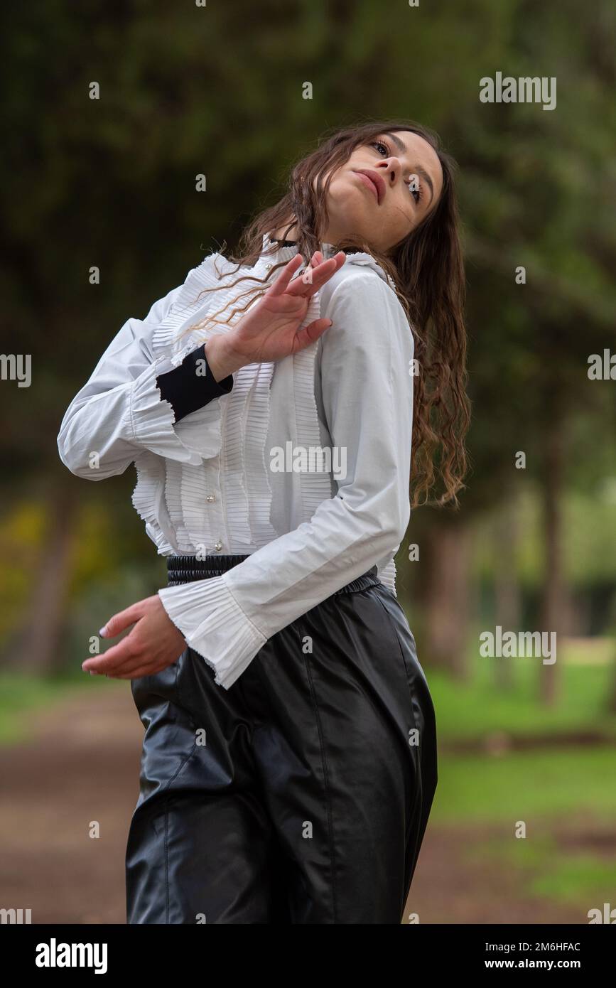 Young woman dancing outdoors. Dance performance in the street Stock ...
