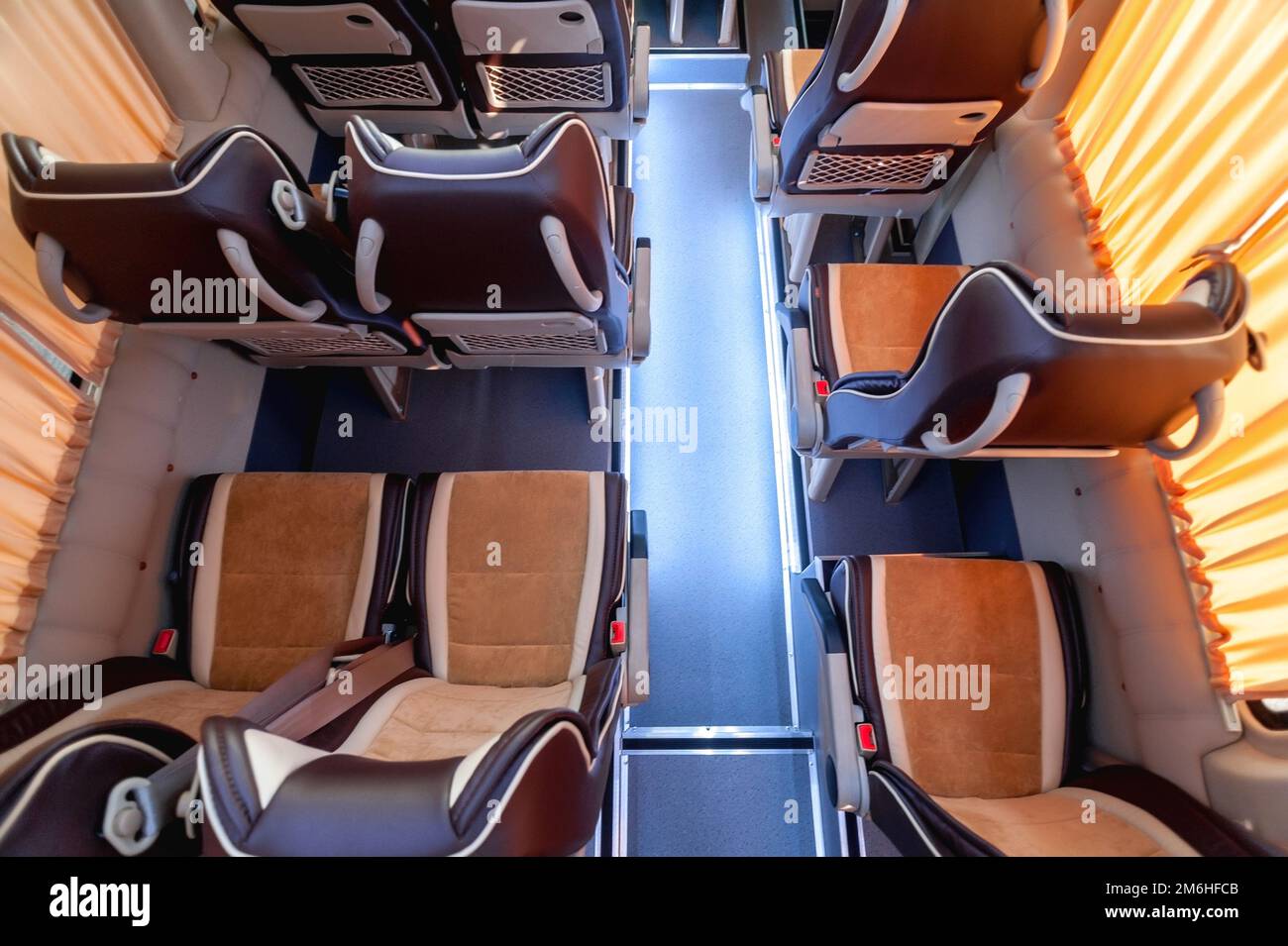 comfortable passenger bus interior with upholstered seats; individual ...