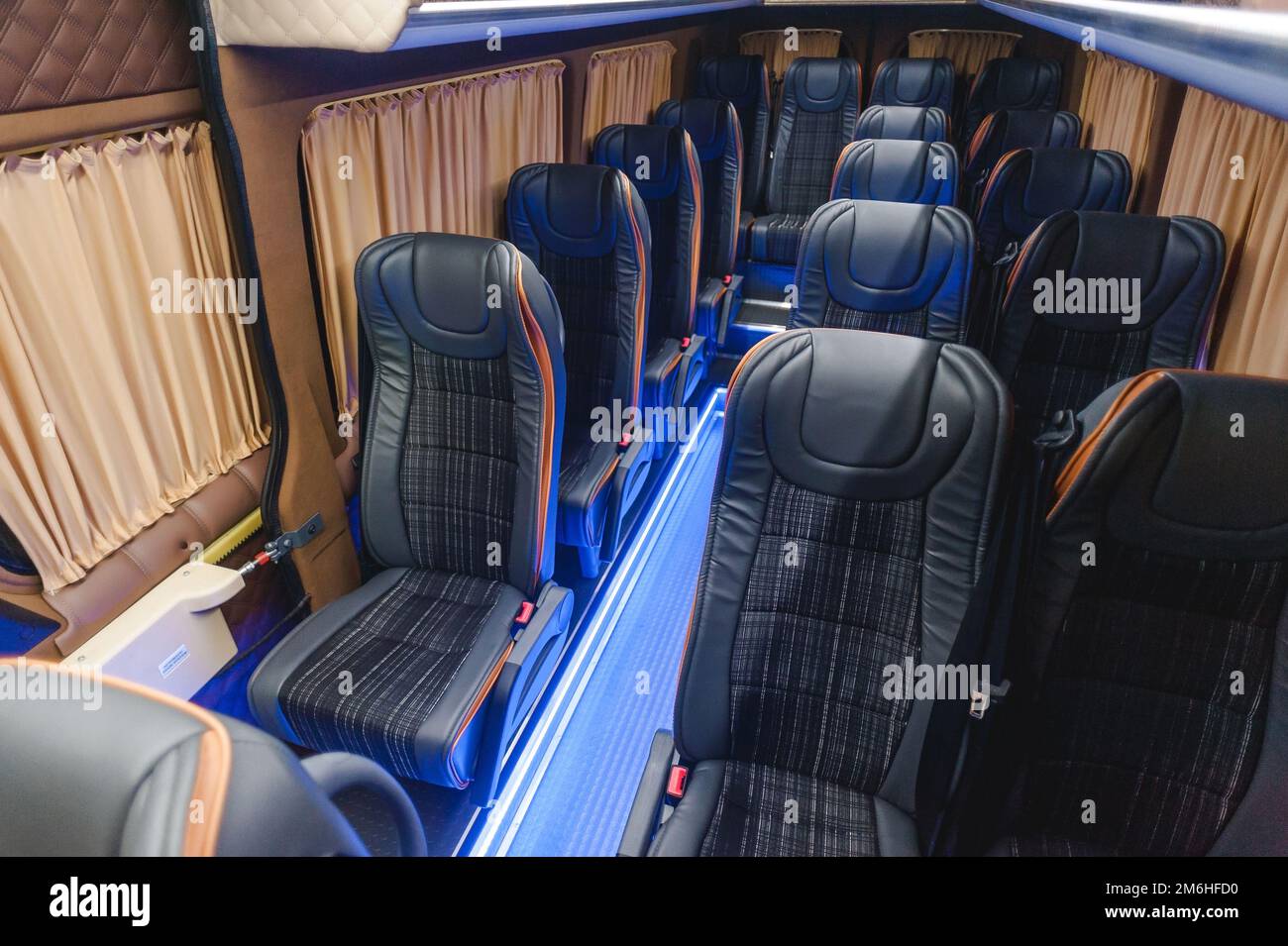 comfortable passenger bus interior with upholstered seats; individual ...