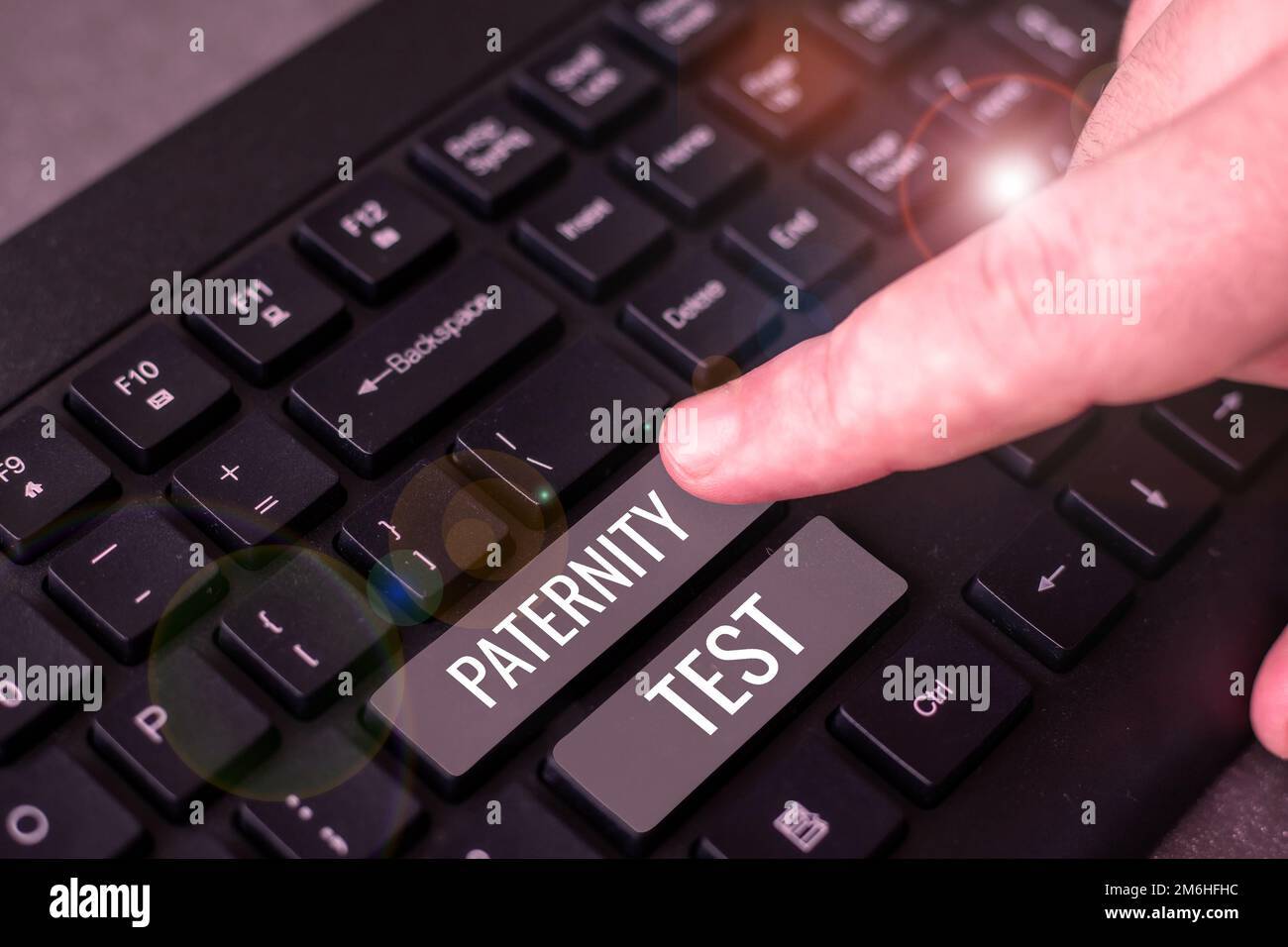 Handwriting text Paternity Test. Word Written on a test of DNA to ...