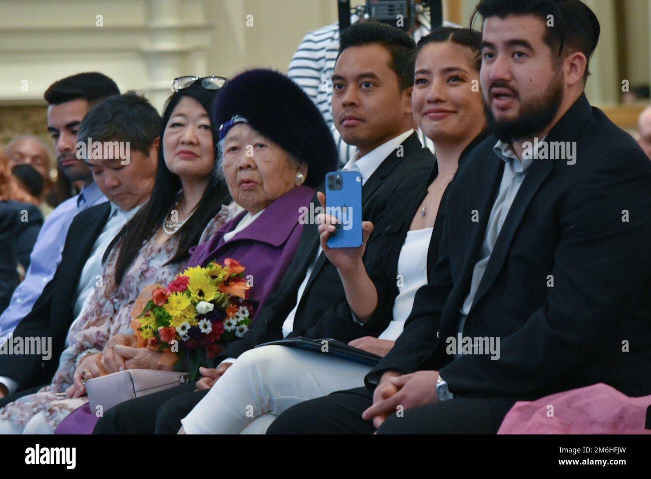 Army Major Gen. Garrett Yee’s family members look on as he thanks them ...