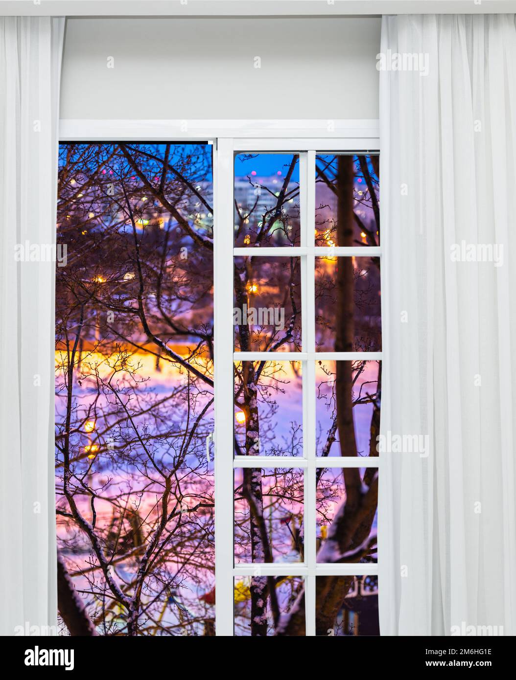 Evening city outside the window Stock Photo - Alamy