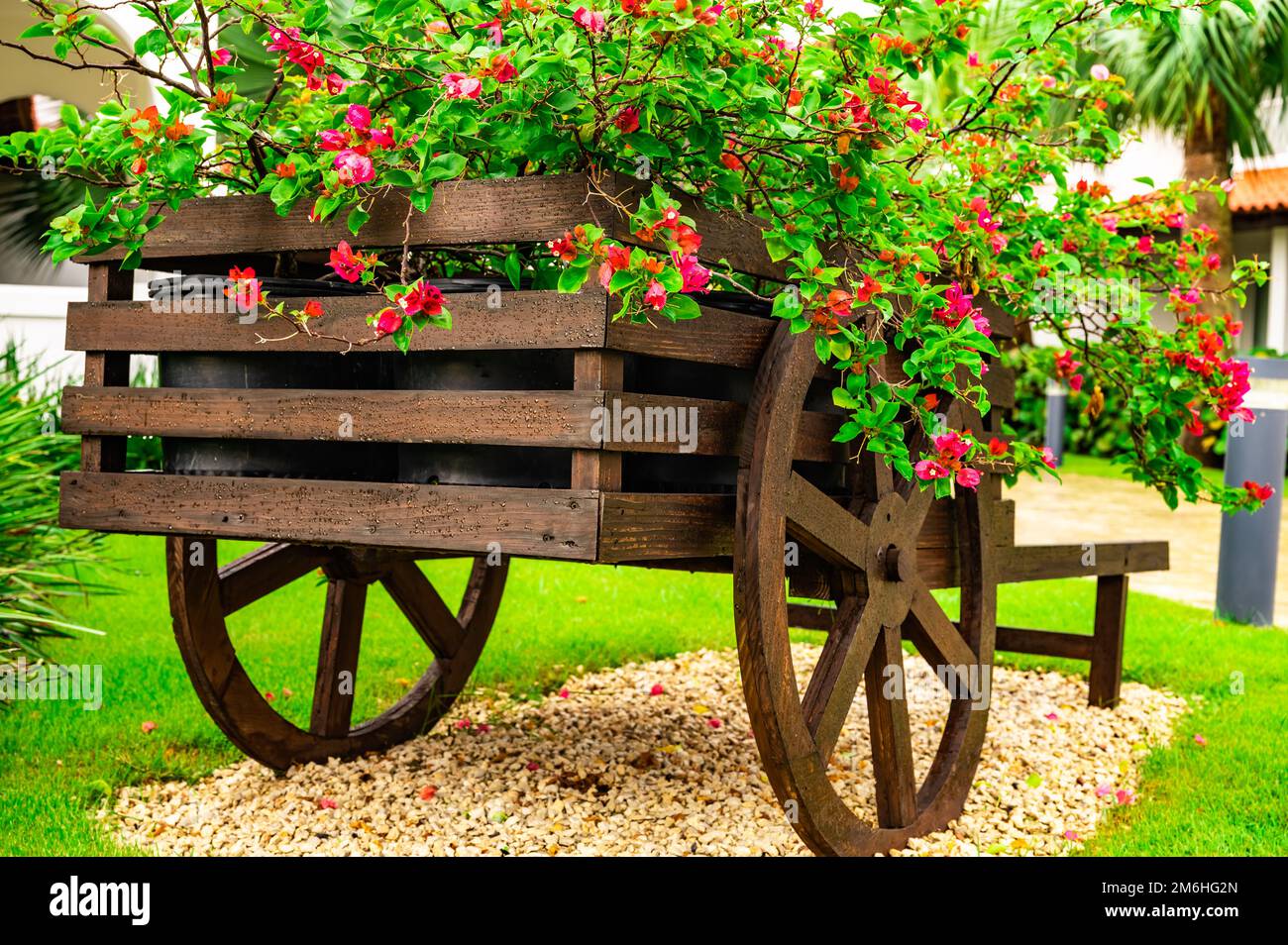 Decorative wooden cart with flowers Stock Photo - Alamy