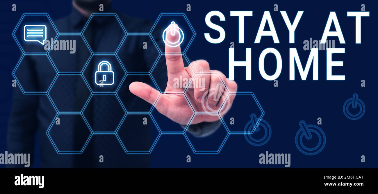 Sign displaying Stay At Home. Word for movement control restricting ...
