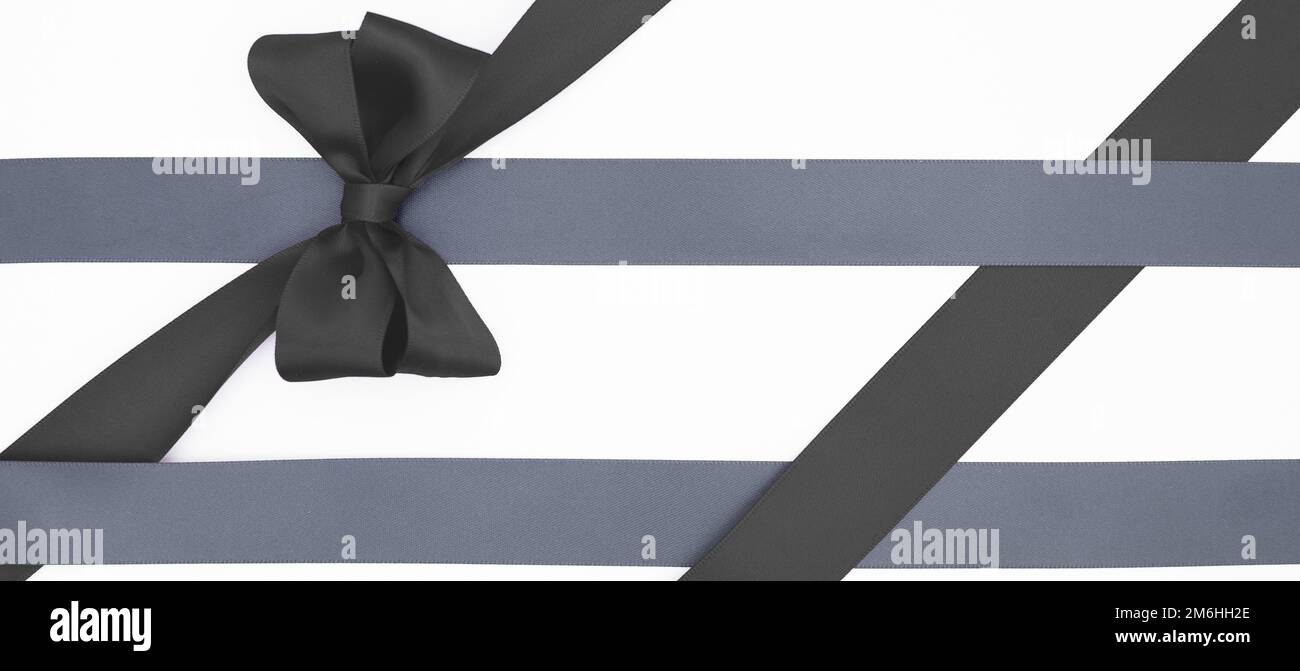 Satin ribbon bows for gift pack in gray and black colors, isolated on ...
