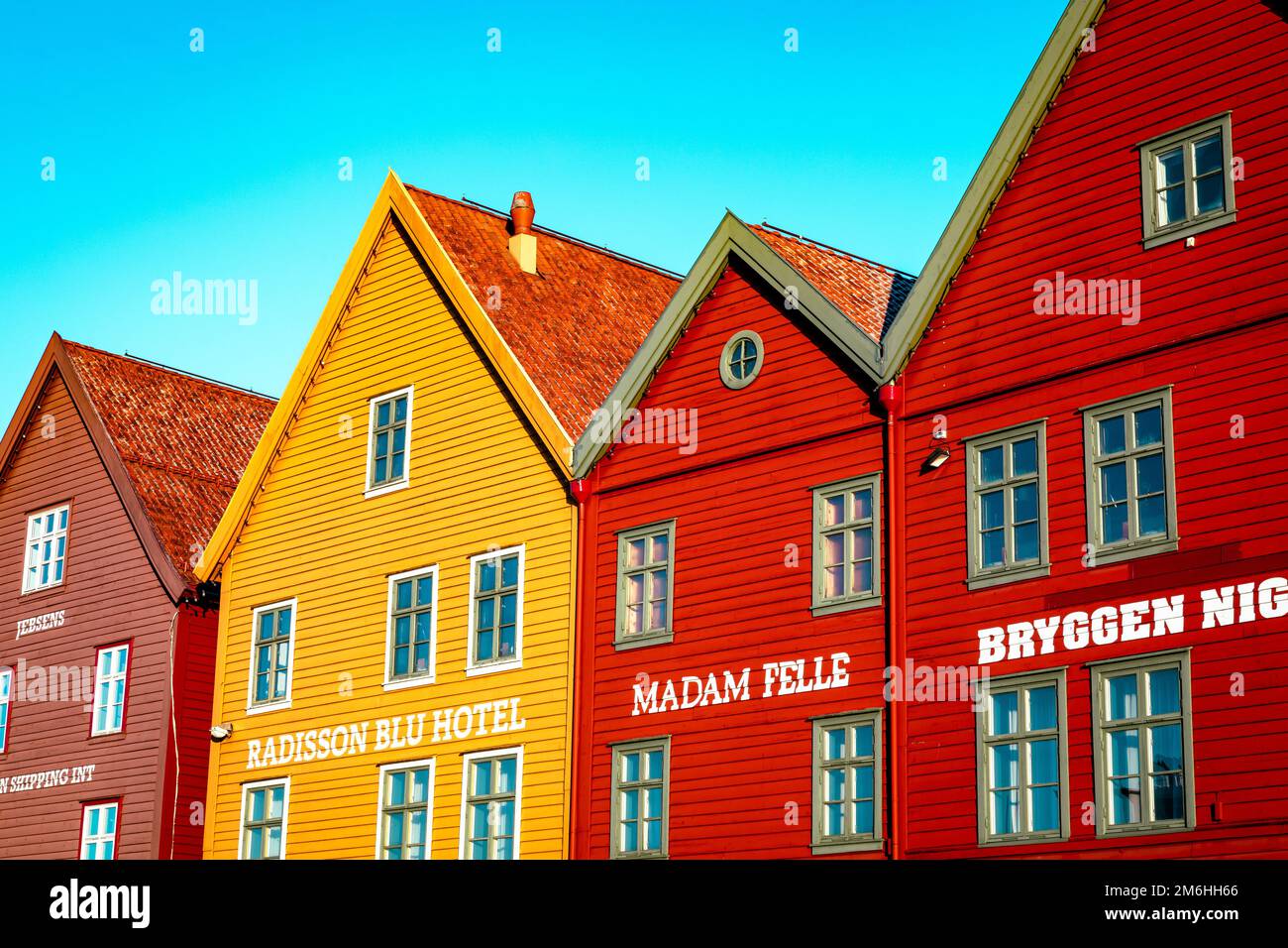 Famous Bryggen street with historical wooden colored houses. Hanseatic ...